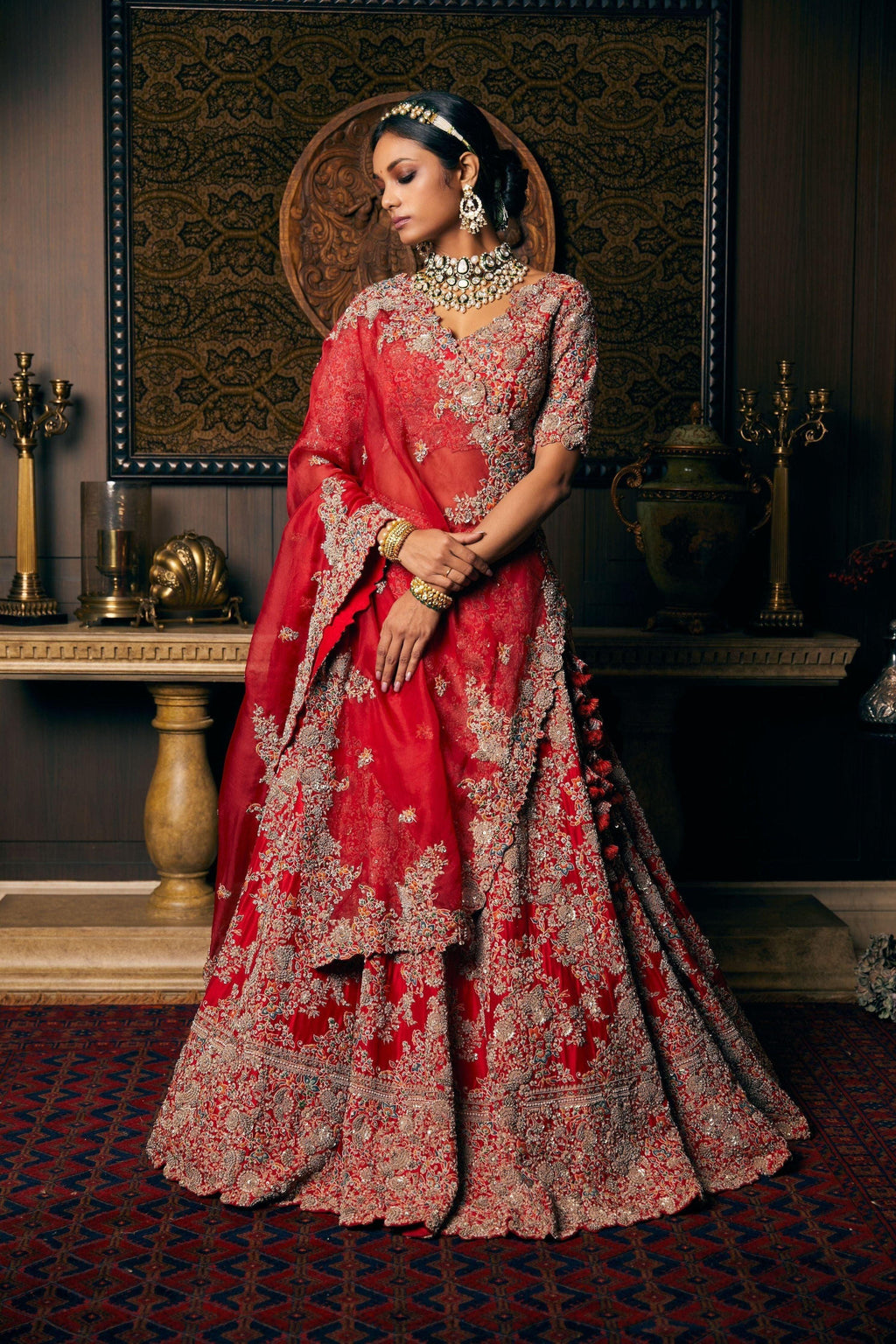 Blood red silk lehenga and blouse with organza dupatta and veil